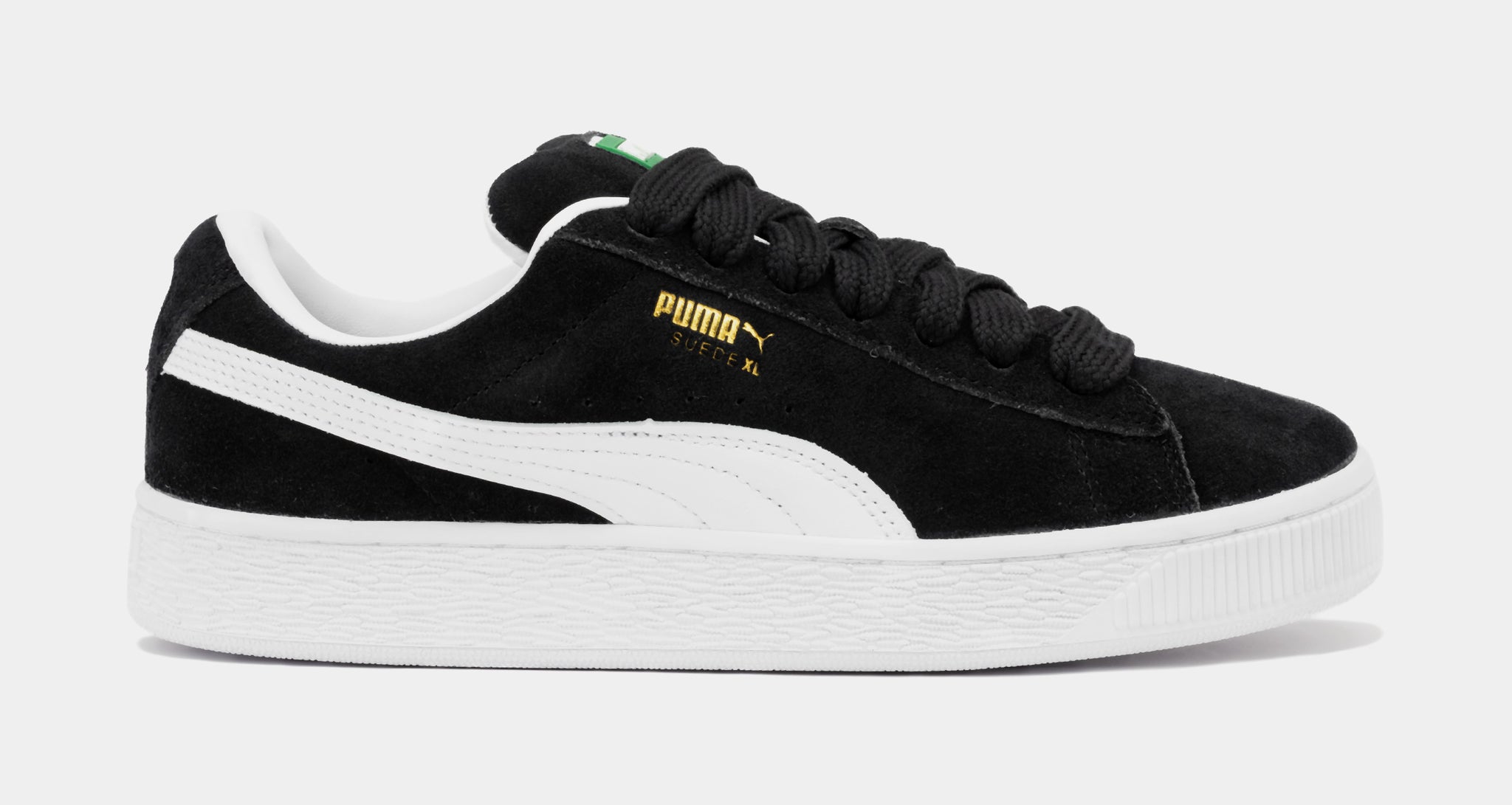 white and black puma shoes